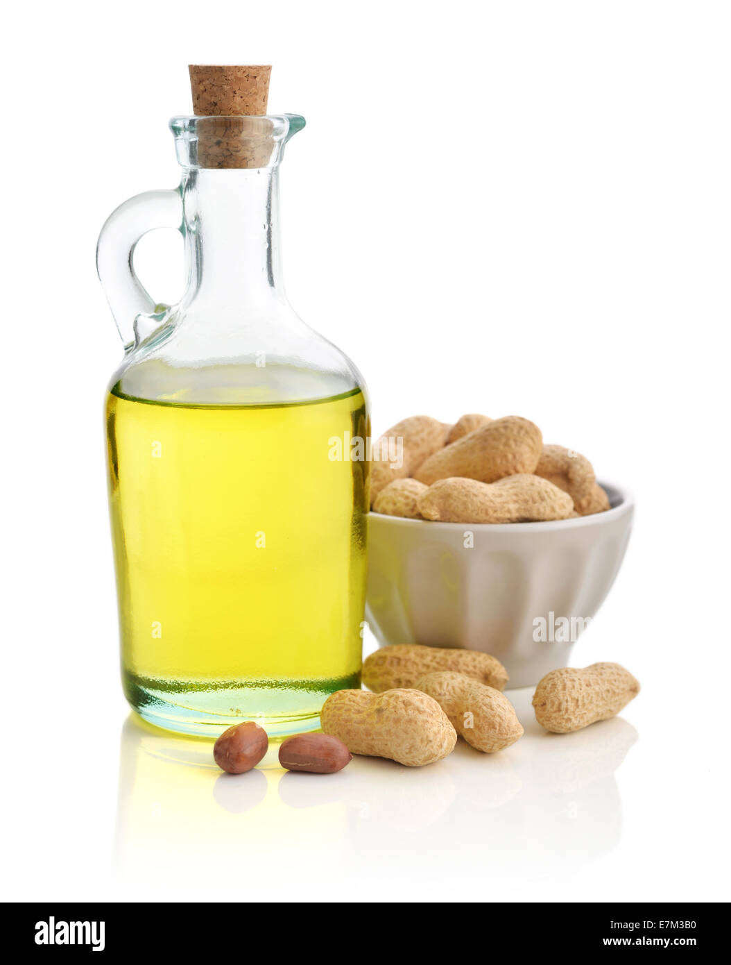 Peanut oil with raw peanuts isolated on white background Stock Photo ...