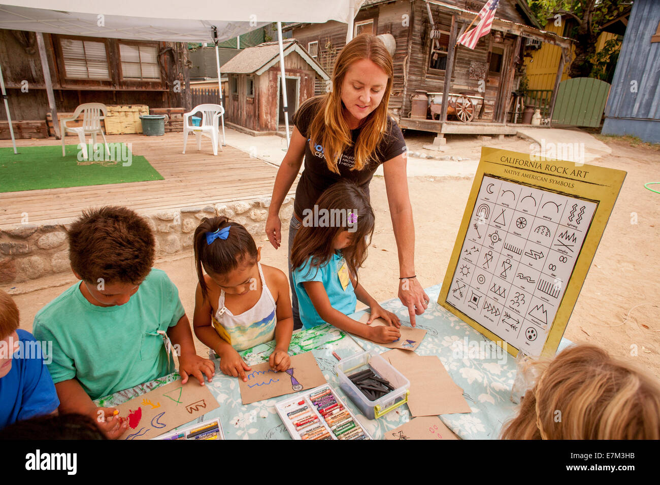 An anthropology museum curator shows a youth group examples of Native ...