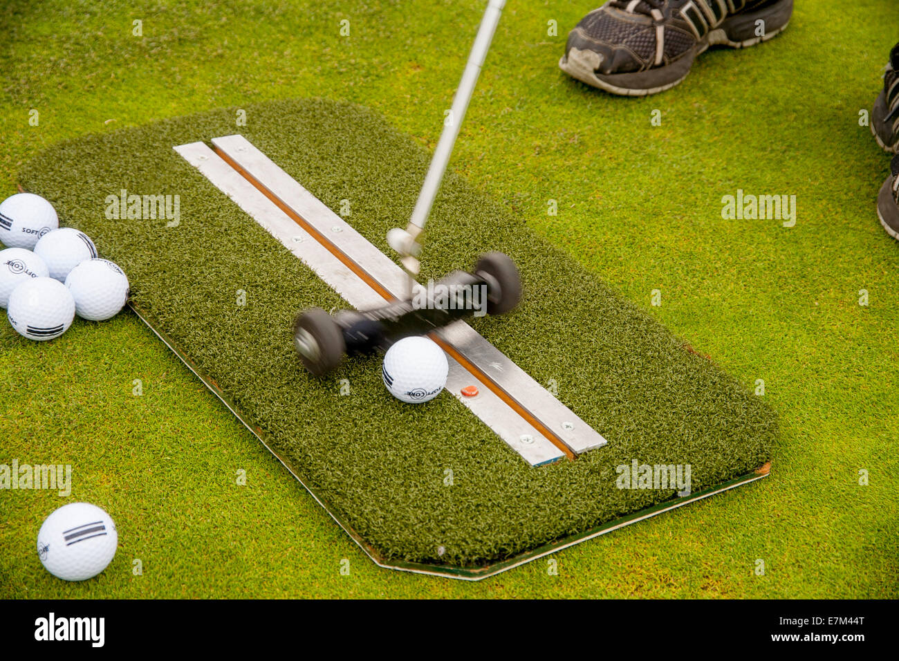 A ball is about to be hit with the "adjustable putter" at the Junior ...