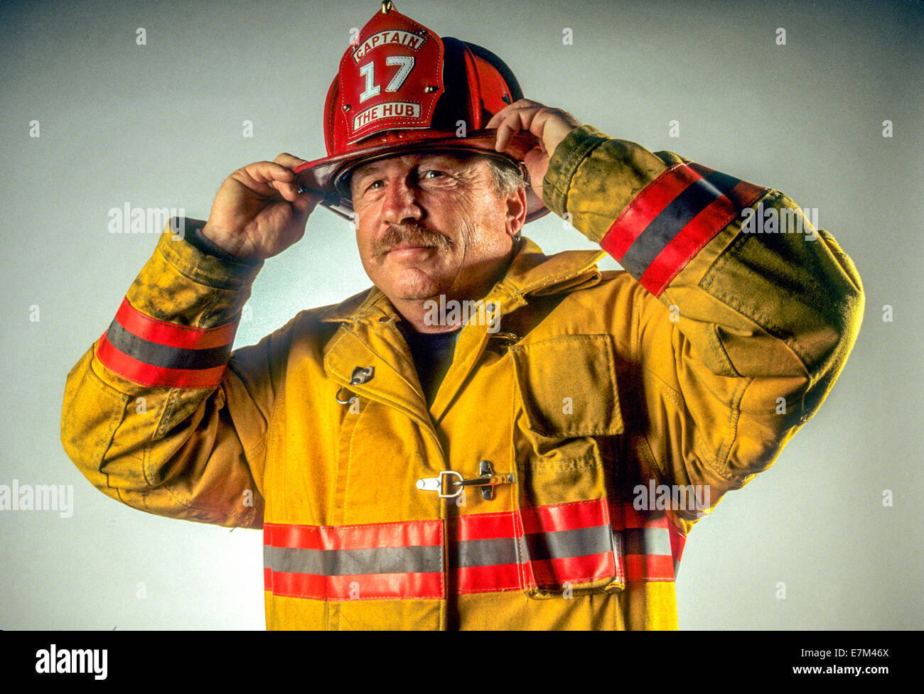 While wearing his safety coat, a captain in the San Diego, CA, fire ...