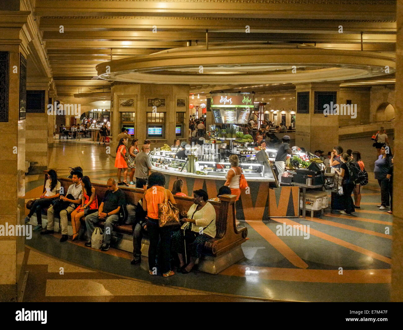 People wait for trains or snack in the lower concourse of New York City ...