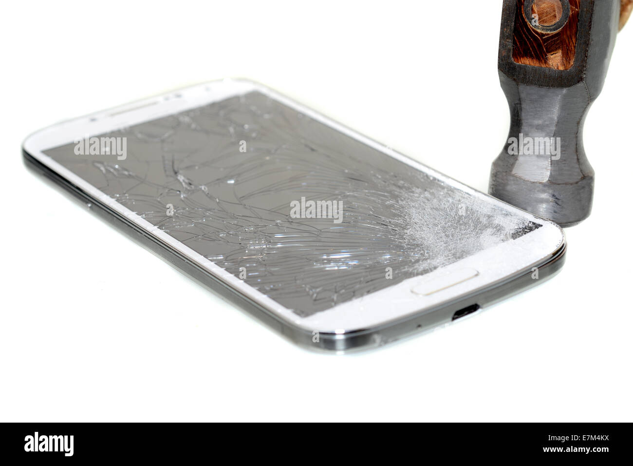 Cell phone with a broken screen hit by a hammer isolated on white Stock ...
