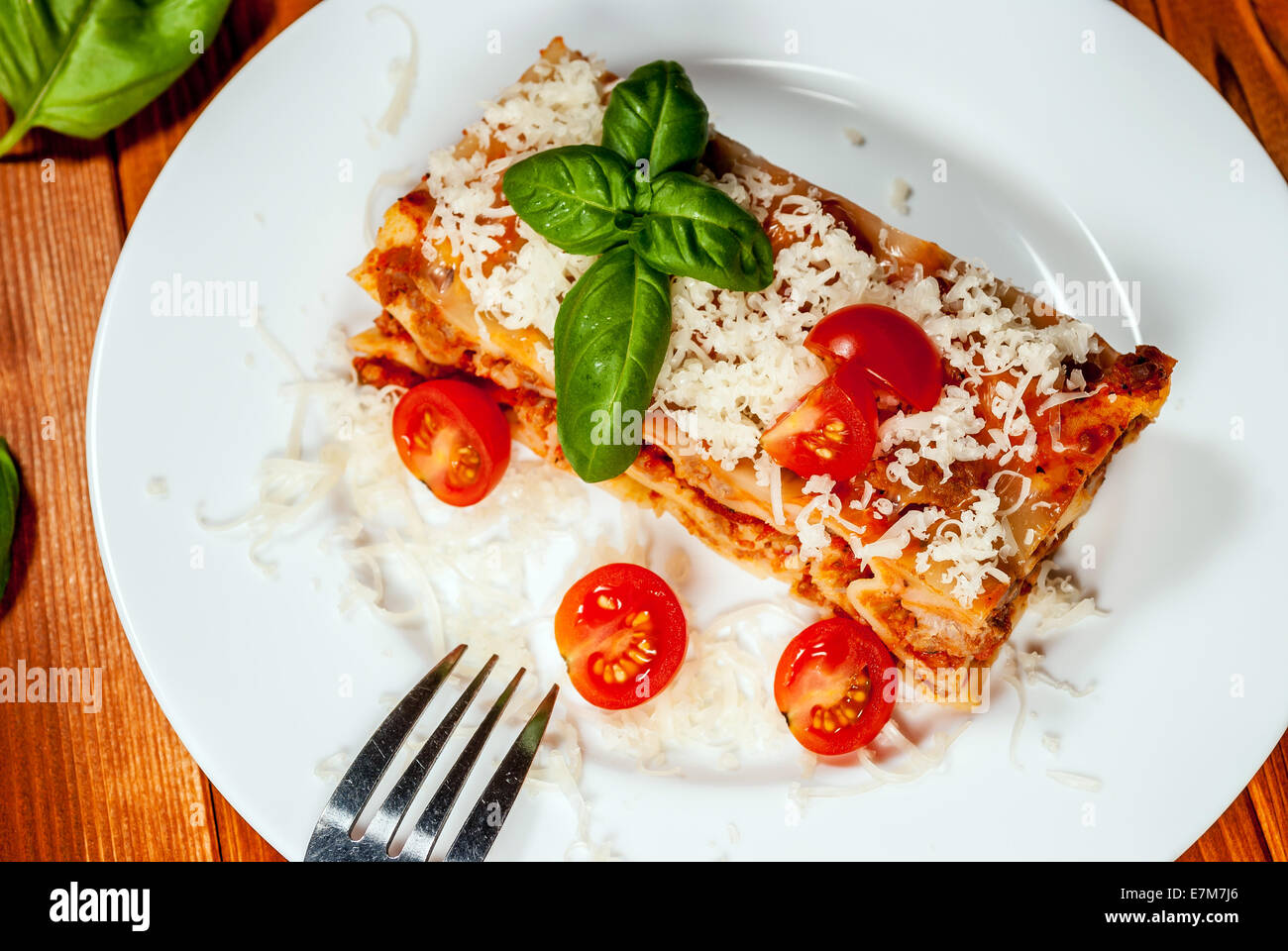 Italian lasagne with tomato and vegetables and chesse on wood table ...