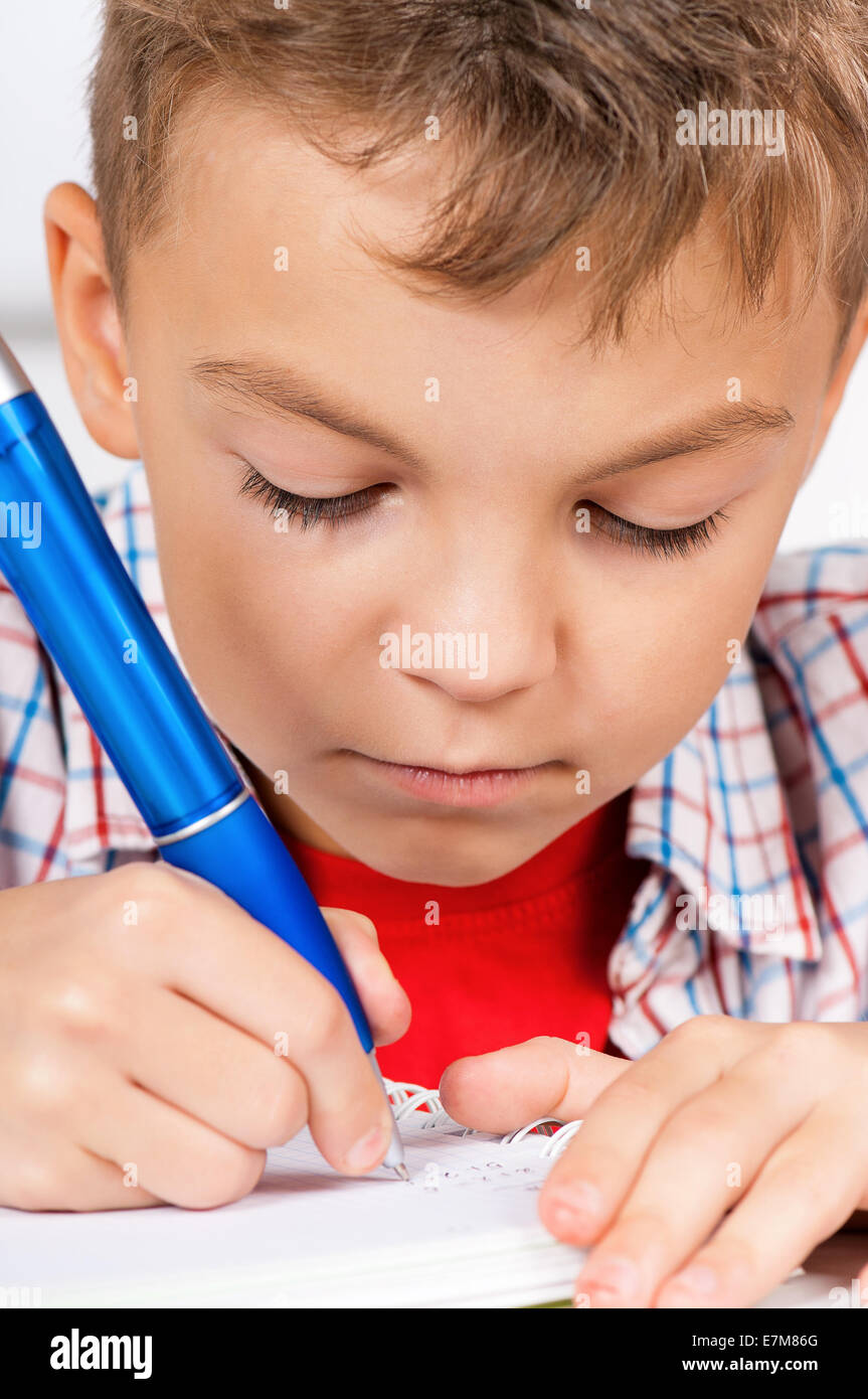 Boy doing homework Stock Photo - Alamy
