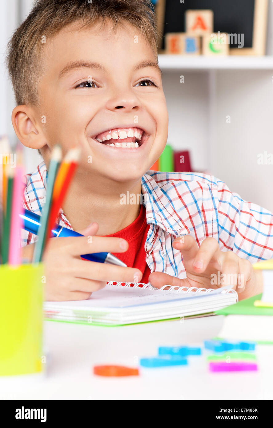 Boy doing homework Stock Photo - Alamy