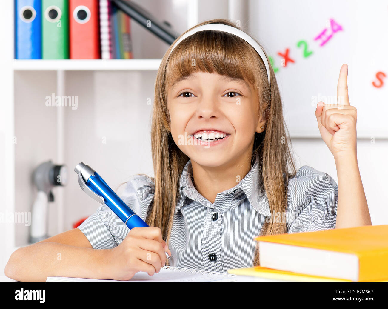 Girl doing homework Stock Photo - Alamy