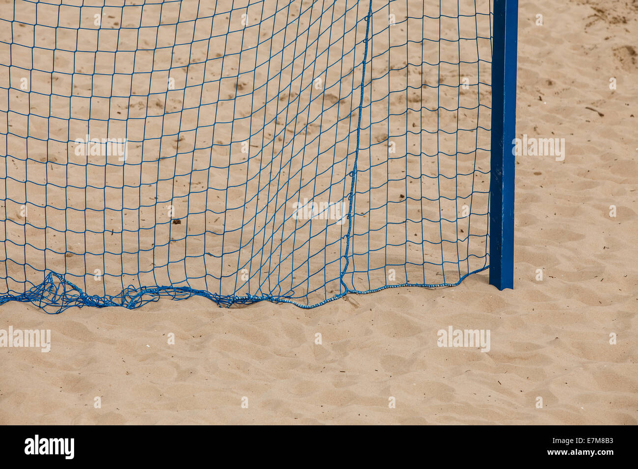 Football summer sport. closeup goal net on a sandy beach outdoor ...