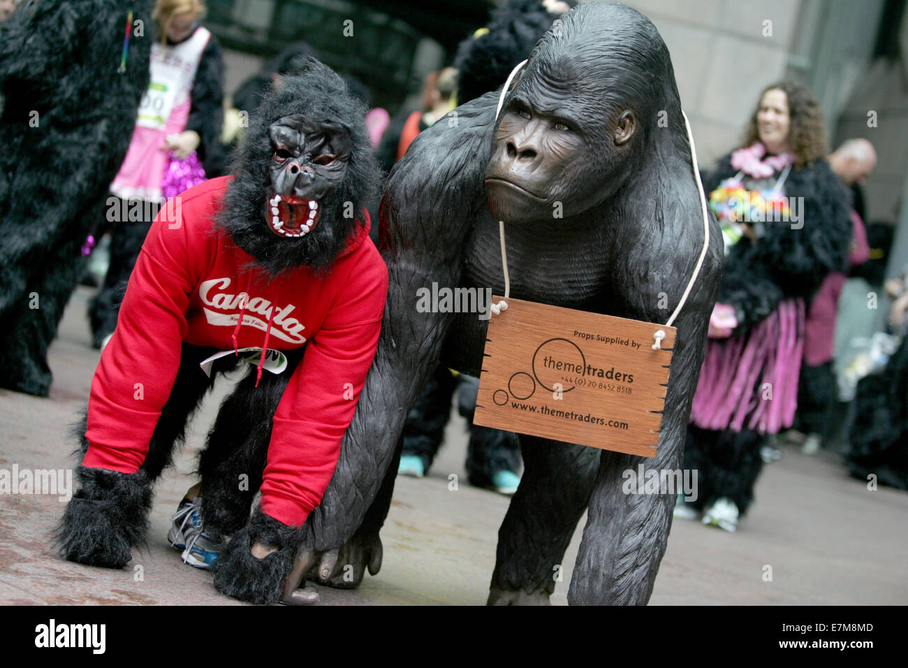 London, UK. 20th Sep, 2014. A participant poses with the Gorilla statue ...