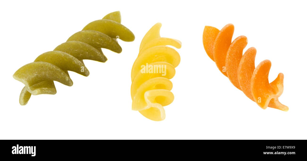 Three fusilli dry and colored pasta isolated on white background Stock ...