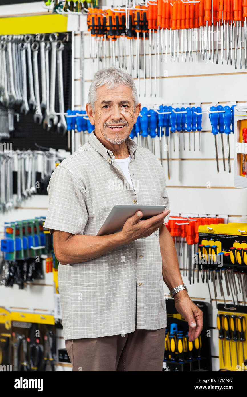 Senior Customer Holding Tablet Computer In Hardware Shop Stock Photo ...