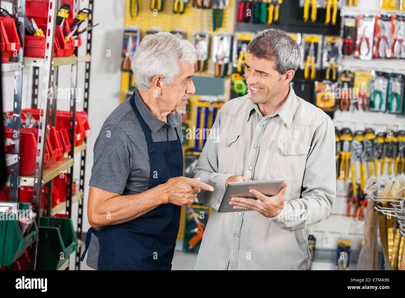 Hardware store salesman checking hi-res stock photography and images ...