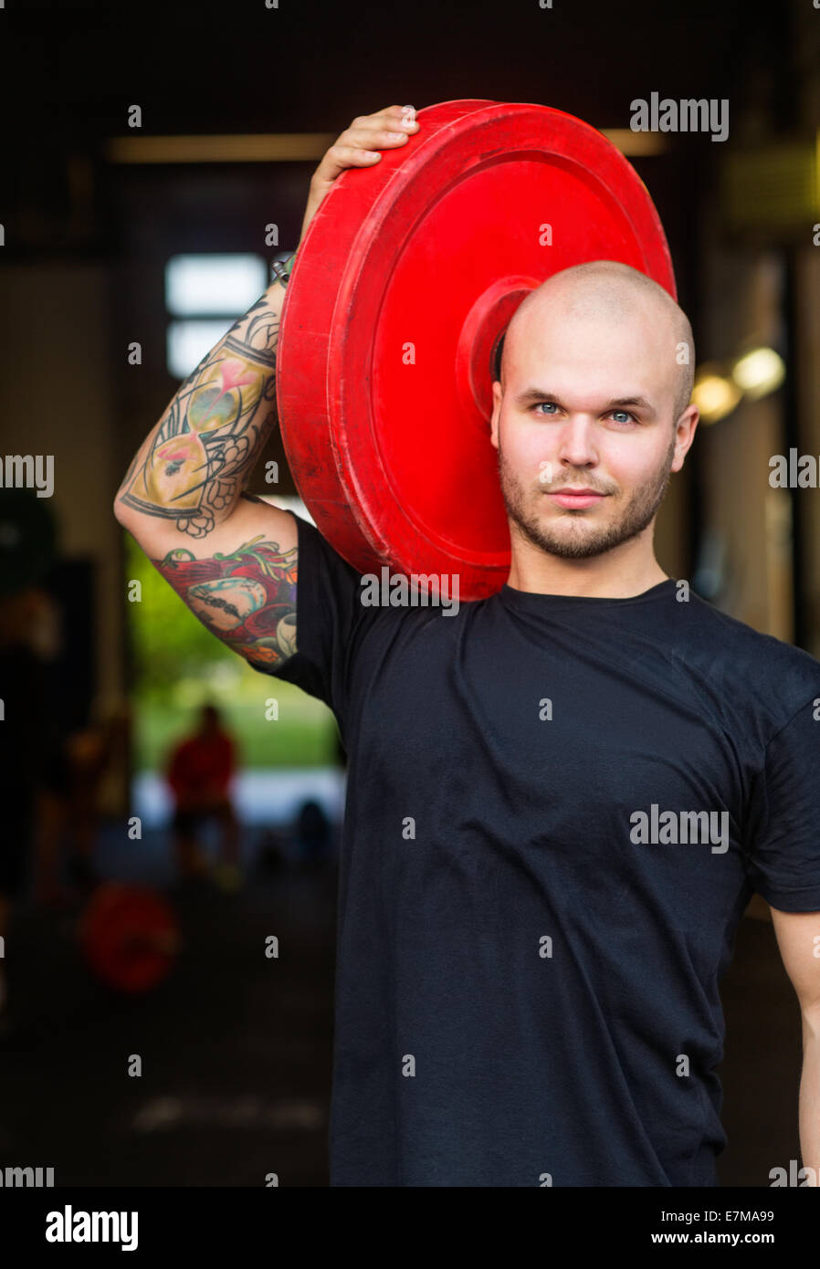 Carrying heavy sport equipment hi-res stock photography and images - Alamy