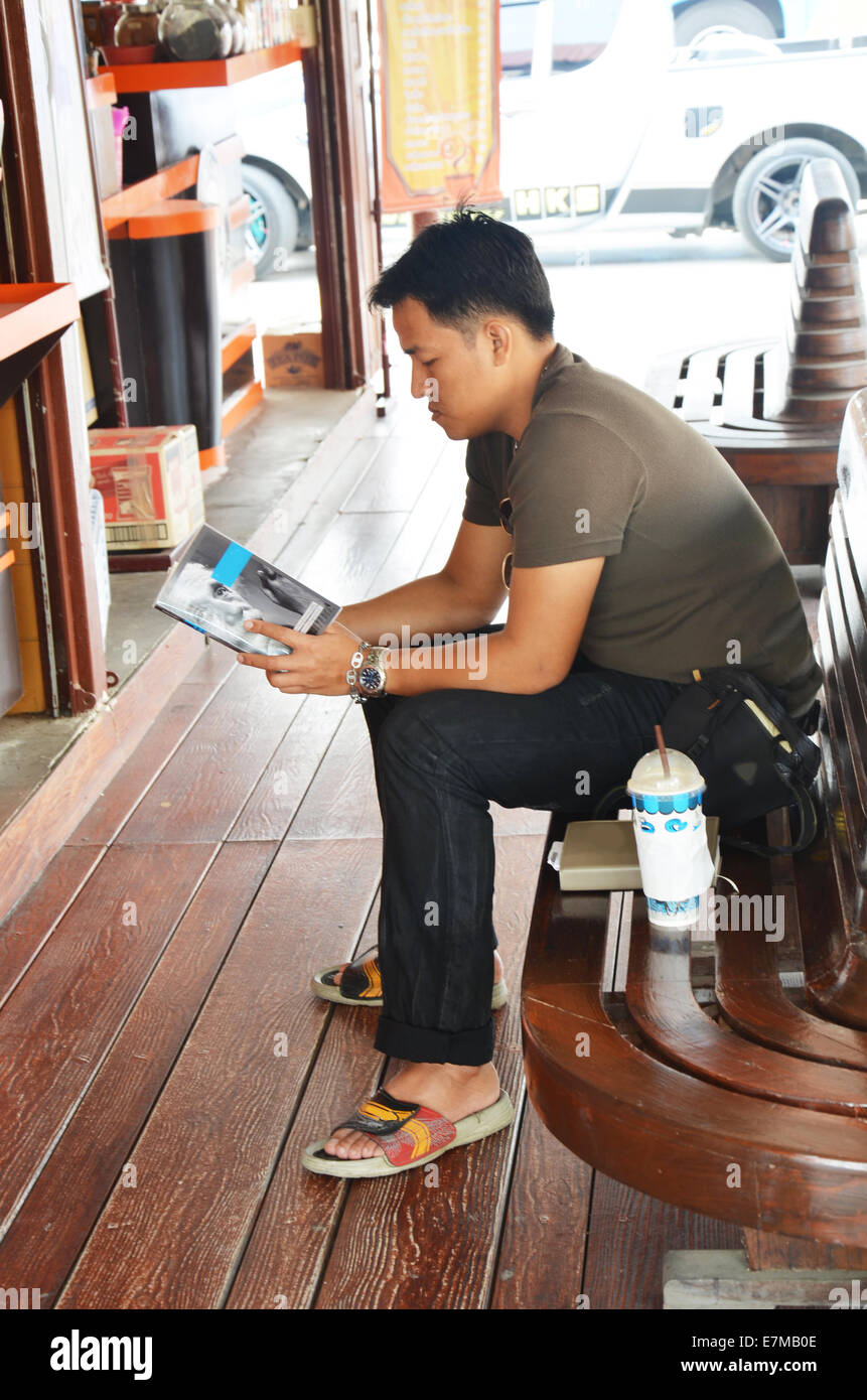 Thai male reading Book Stock Photo - Alamy