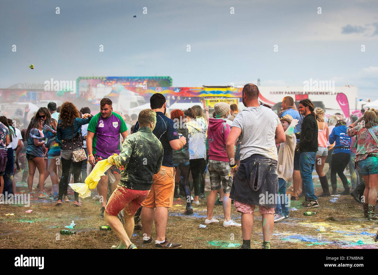 A coloured powder battle at the Brownstock Festival in Essex Stock ...
