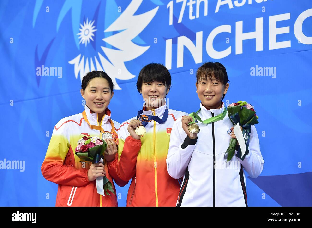 Incheon, South Korea. 21st Sep, 2014. Gold medalist Zhang Yuhan (C) of ...
