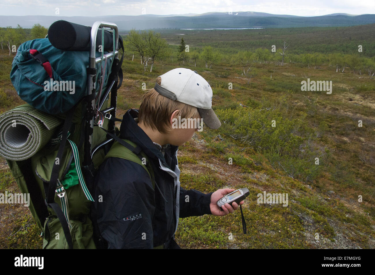 Hiker is navigating with gps Stock Photo - Alamy