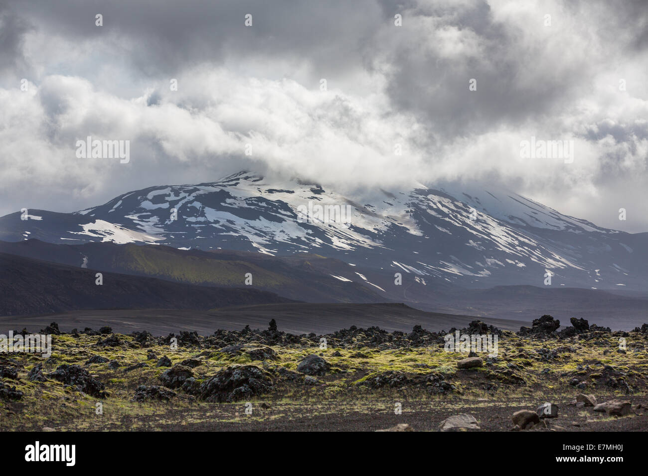 Icelandic volcano with snow and cloudy sky Stock Photo - Alamy
