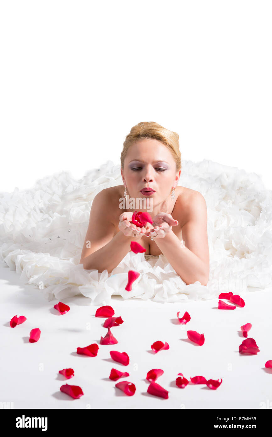 Beautiful bride, posing , whith flower, and rose petals Stock Photo - Alamy
