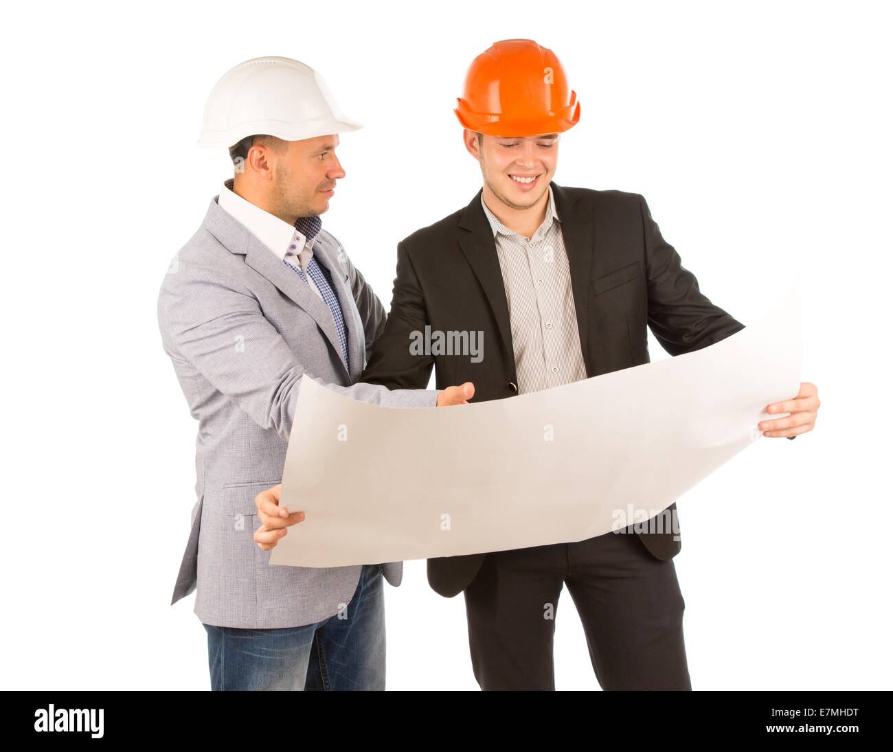 Two young architects or structural engineers standing discussing a ...
