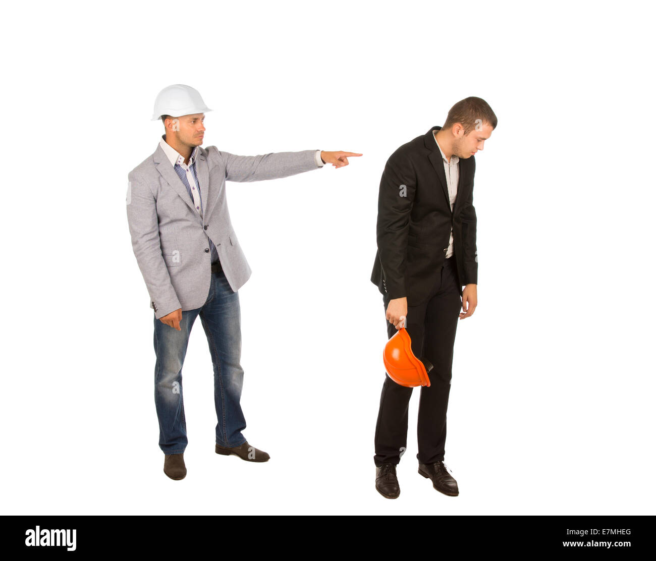 Head Engineer in White Helmet and Gray Coat Pointing Subordinate While ...