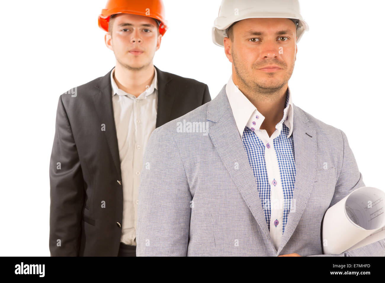 Close up Serious Good Looking Male Engineers with Helmets Looking at ...