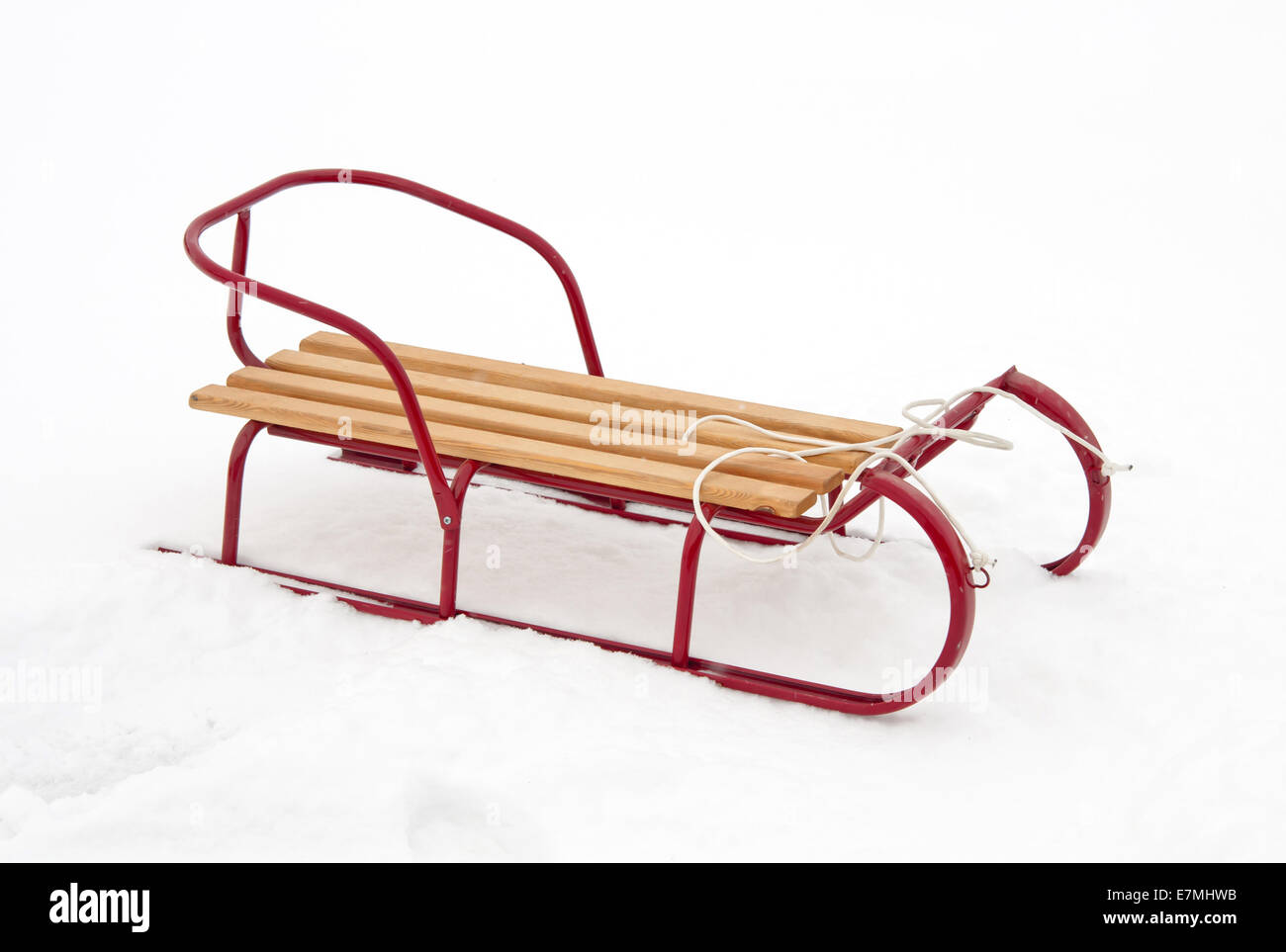 red sledge in the snow Stock Photo - Alamy