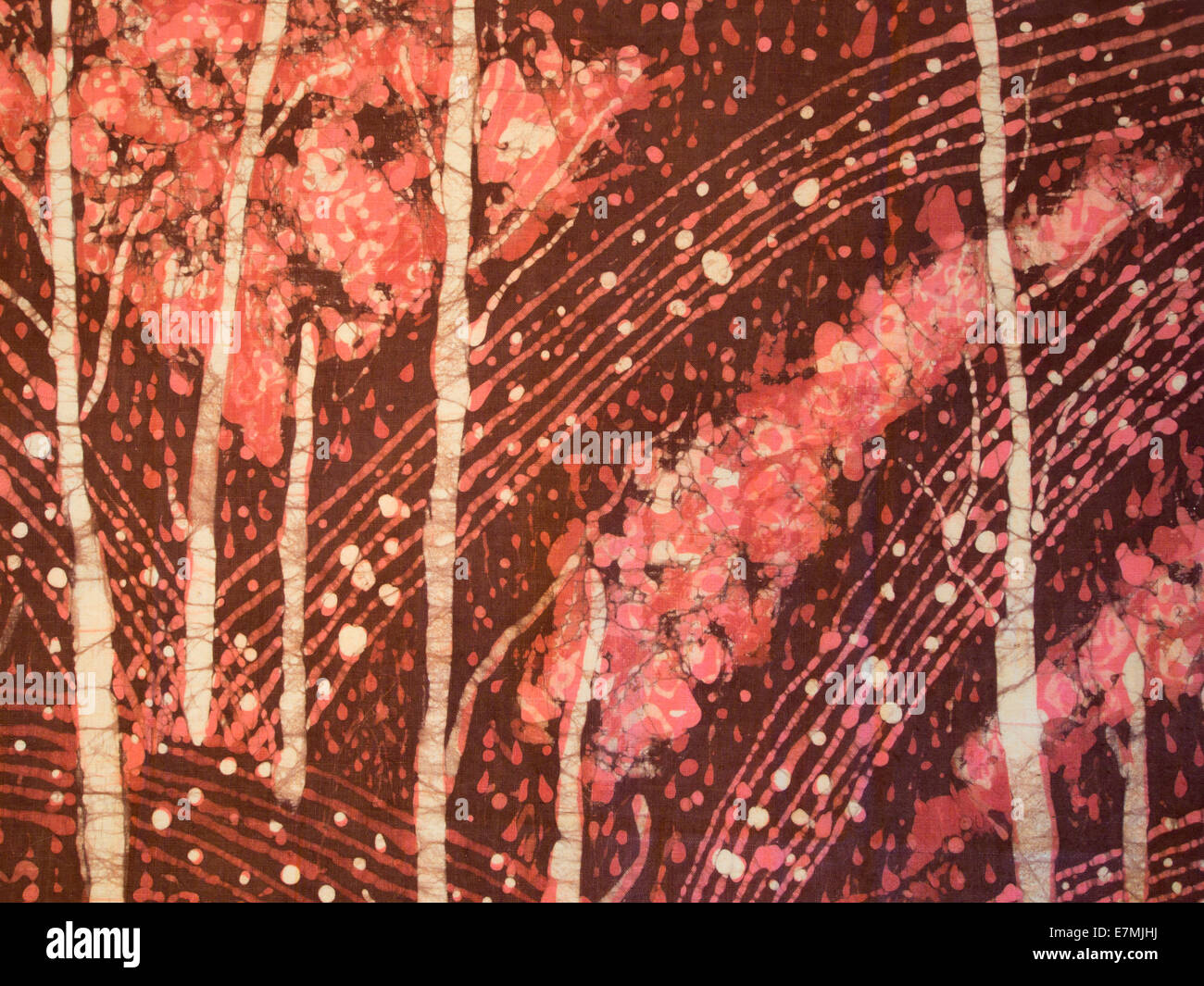 Partial close up of colourful wax batik artwork, nature themed, red ...