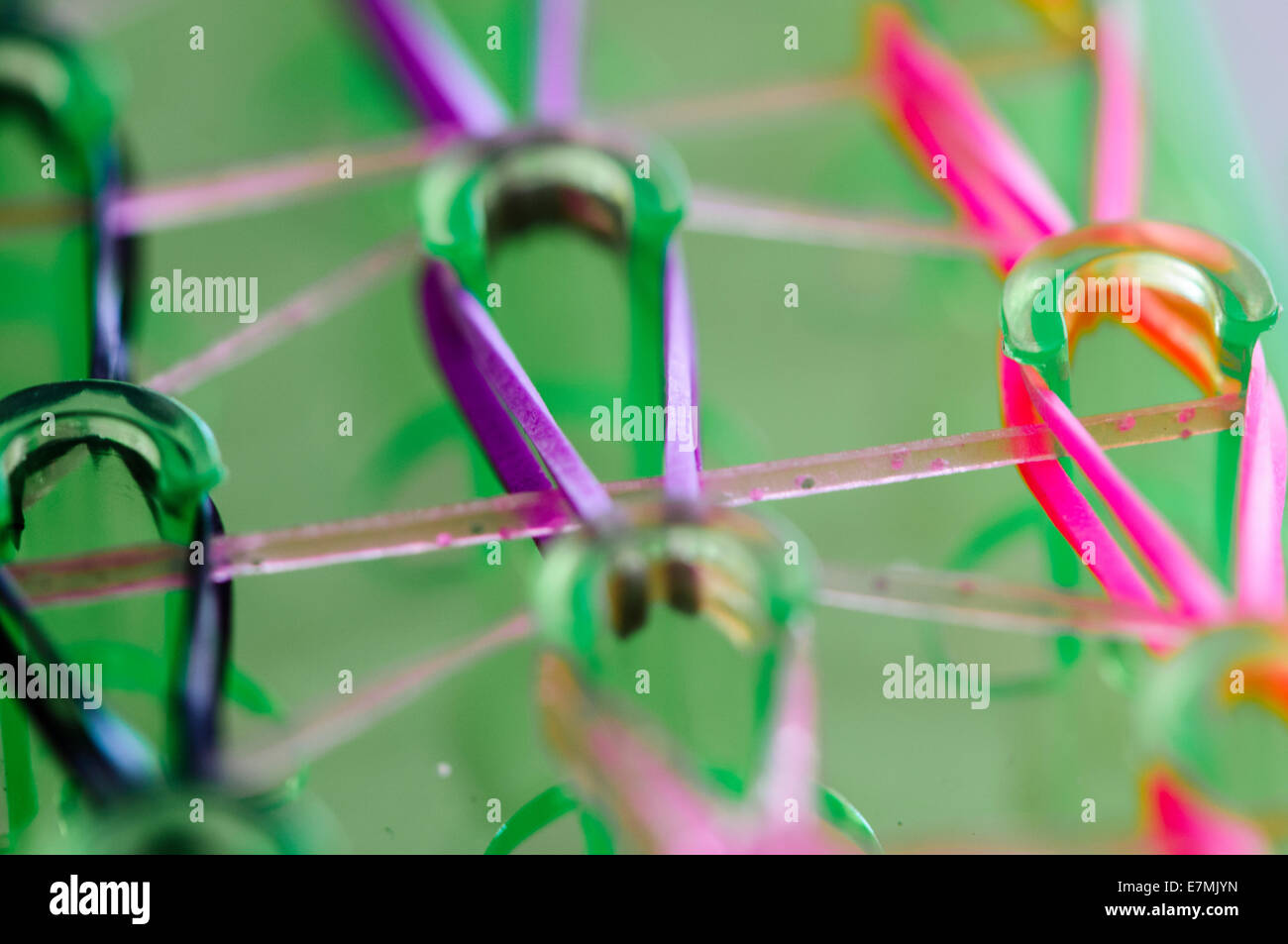 Making loom band friendship bracelets using a loom band frame Stock ...