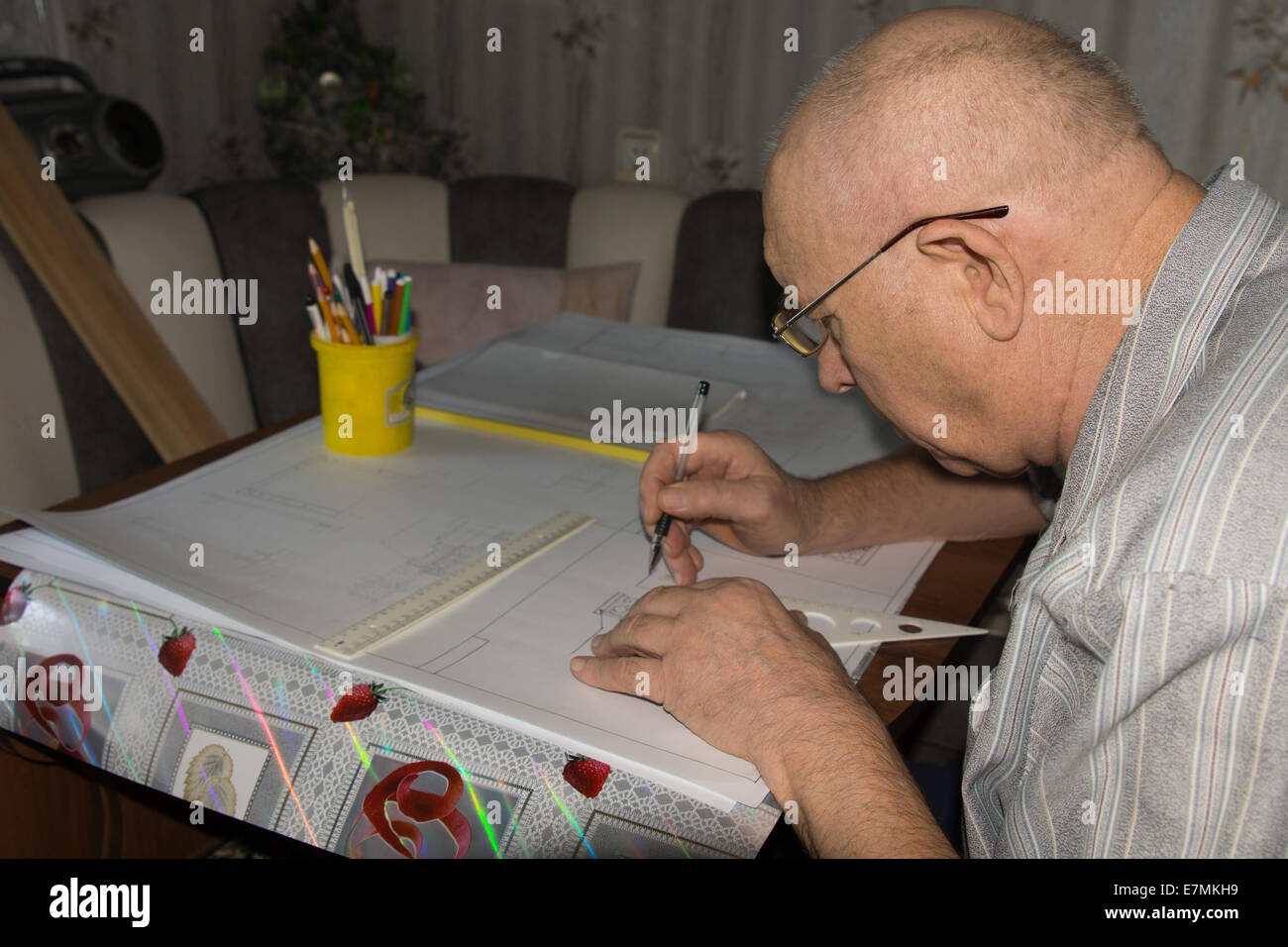 Senior Man Drawing with Drafting Instruments at Table Stock Photo - Alamy