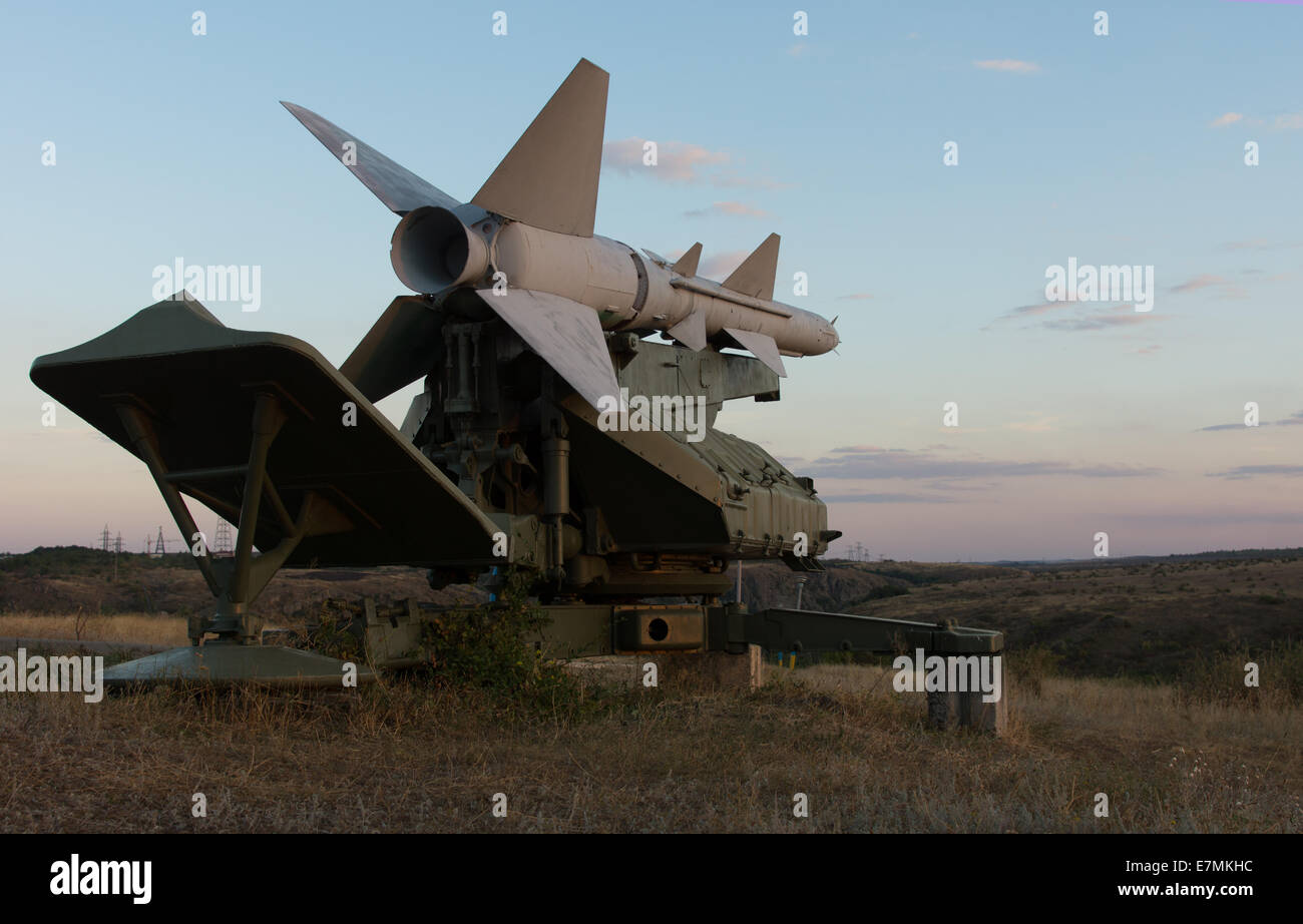 Missile on a rocket launcher viewed close up low angle at dusk as it ...