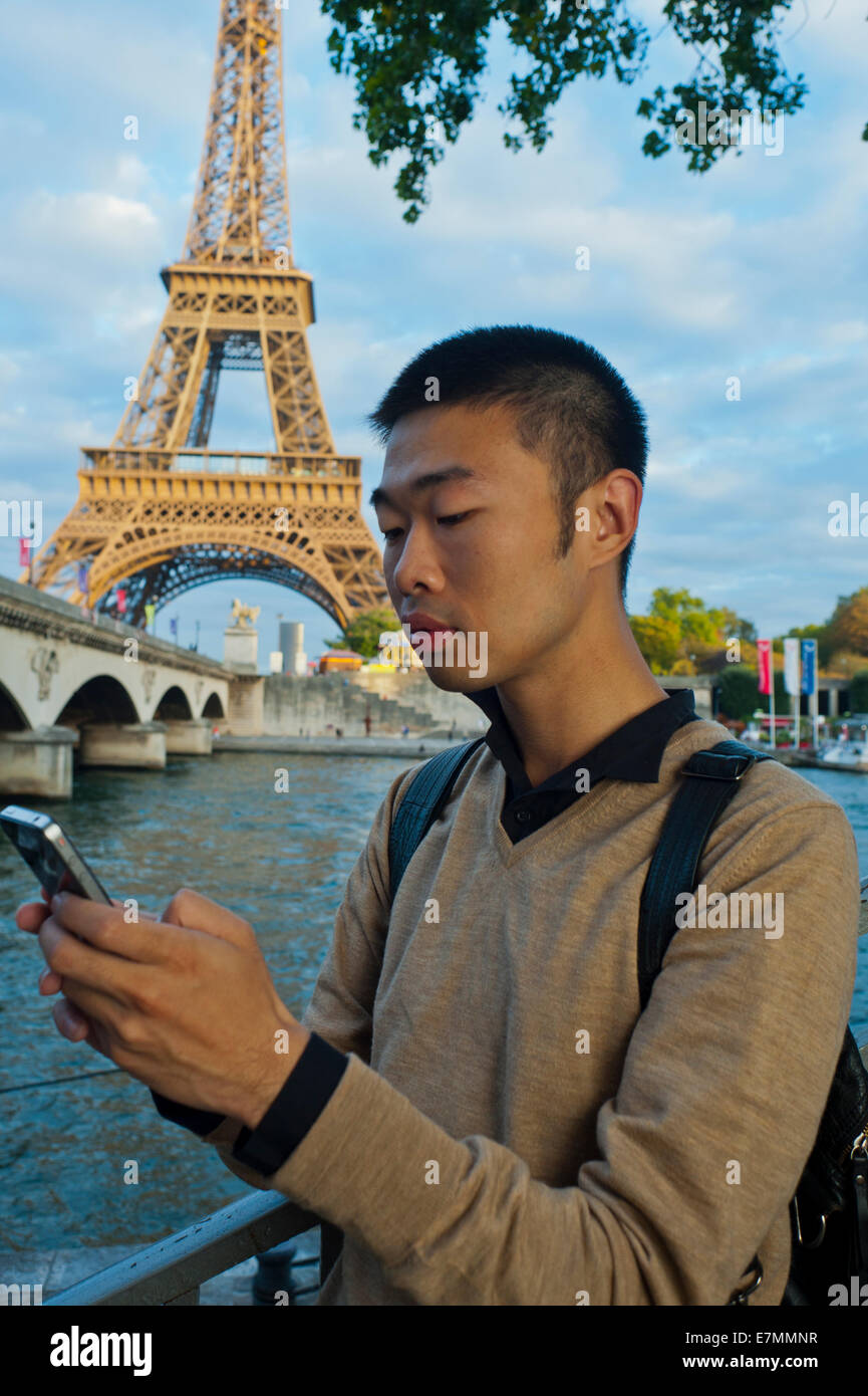 paris, France, Young Chinese Man, Portrait, Using I-Phone Smart Phone ...