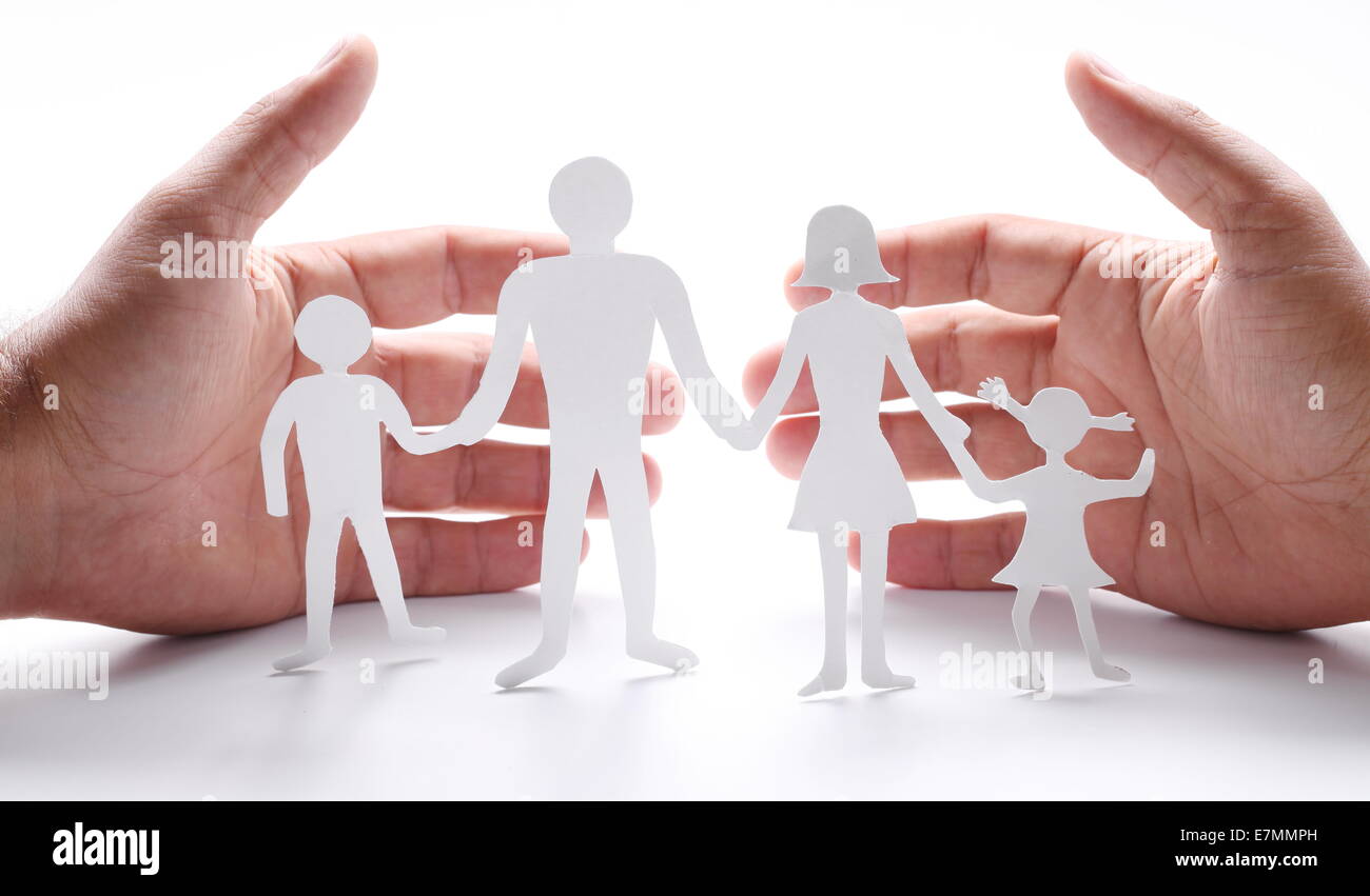 Cardboard figures of the family on a white background. The symbol of ...