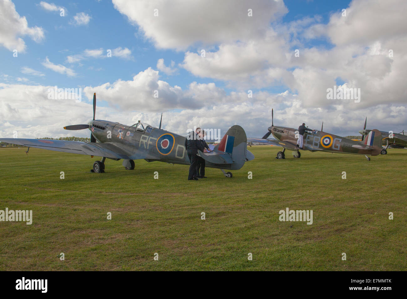 Spitfire and clouds Stock Photo - Alamy