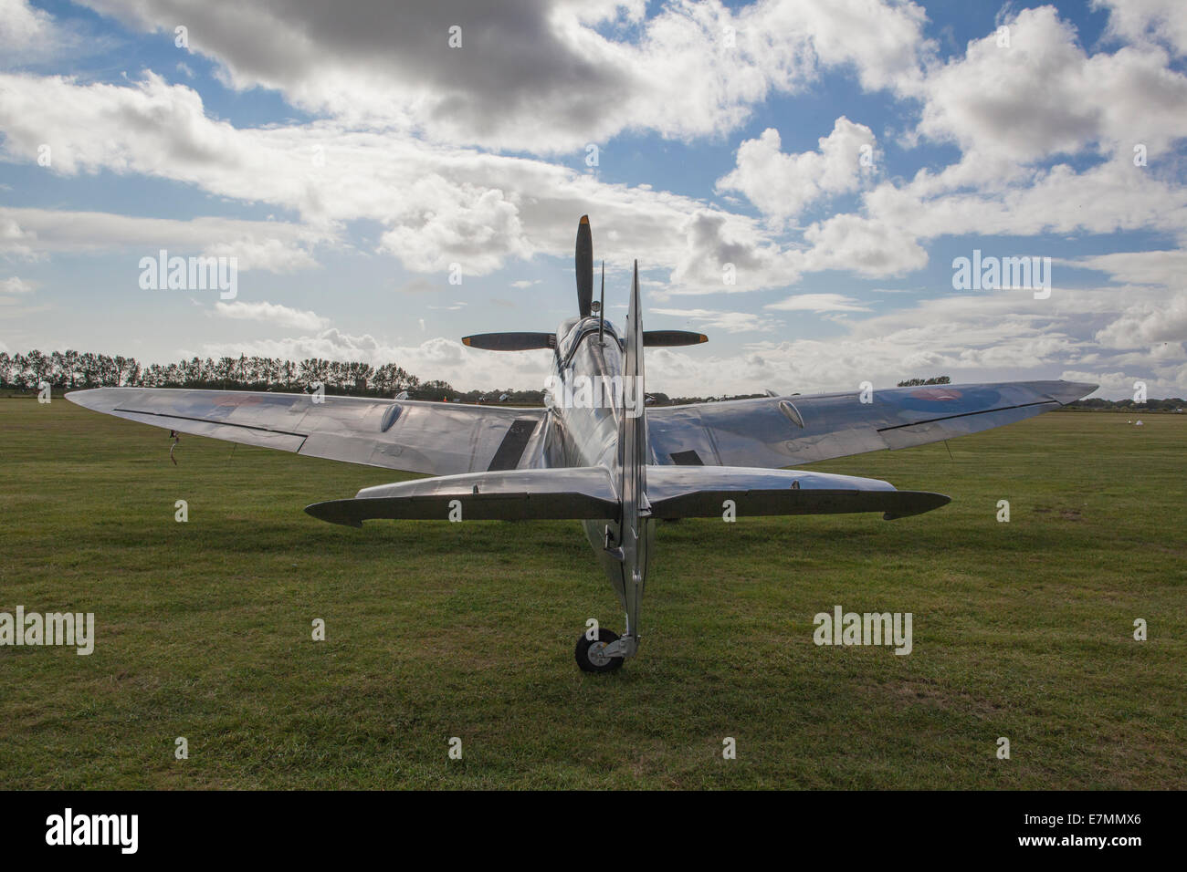 Spitfire and clouds Stock Photo - Alamy