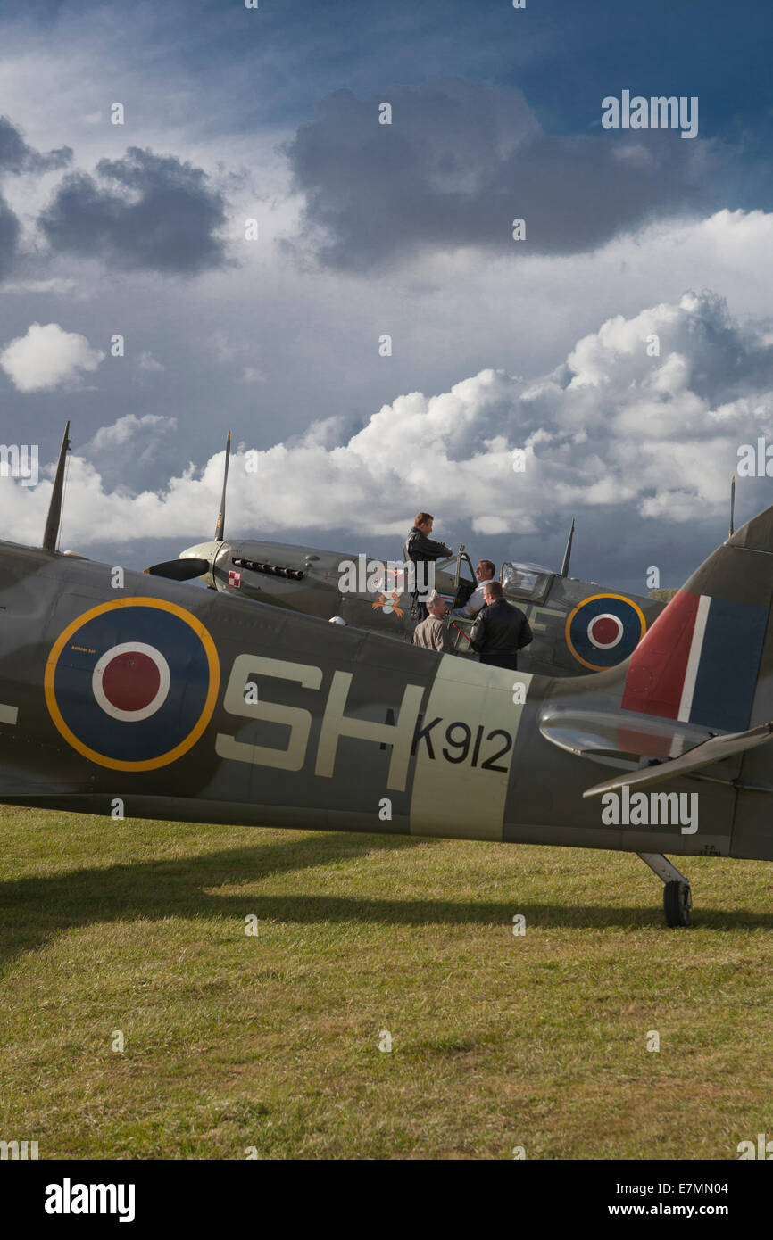 Spitfire and clouds Stock Photo - Alamy