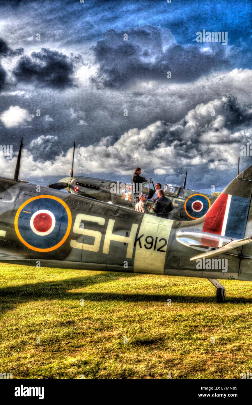 Spitfire and clouds high contrast Stock Photo - Alamy