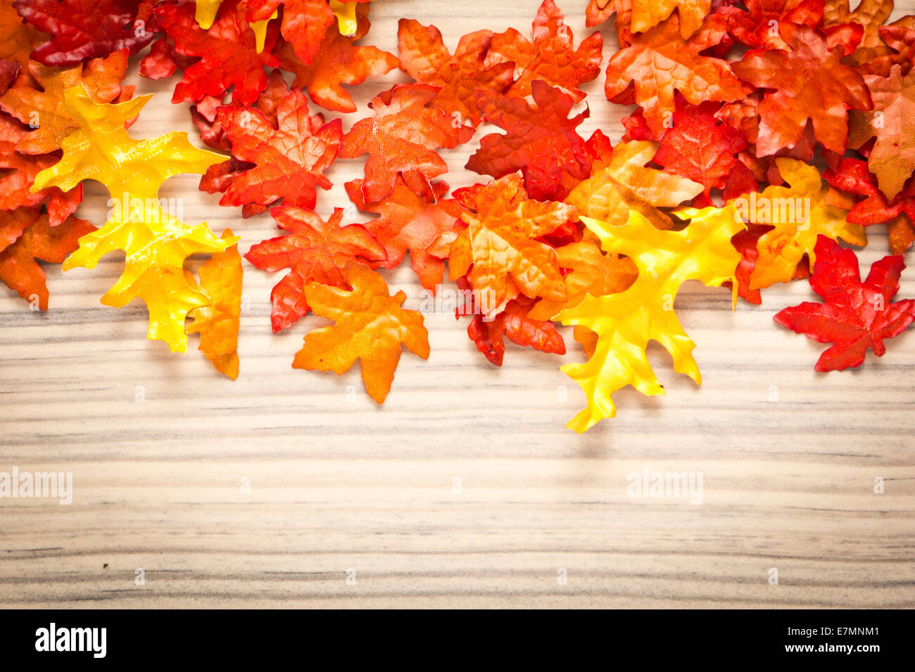 colorful leaves on a rustic wood background Stock Photo - Alamy
