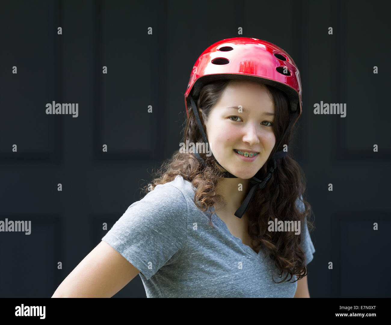 Closeup image of teenage girl, looking forward with helmet on, with ...