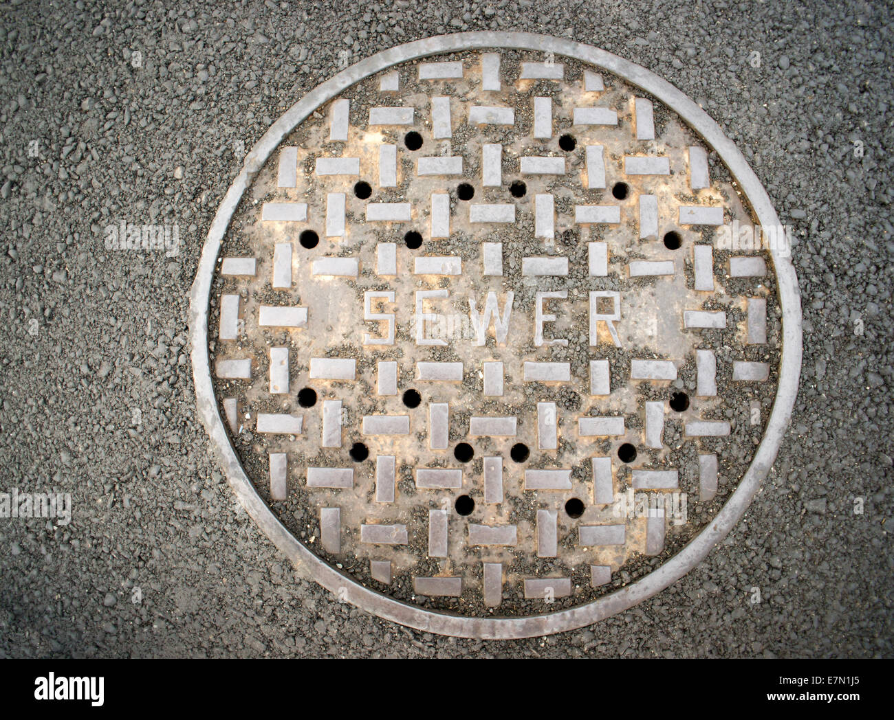 One can even find beauty in a manhole sewer cover Stock Photo - Alamy