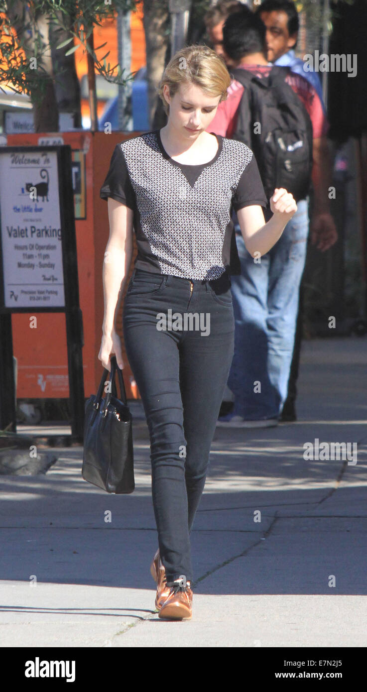Emma Roberts out and about in a patterned top and copper shoes ...