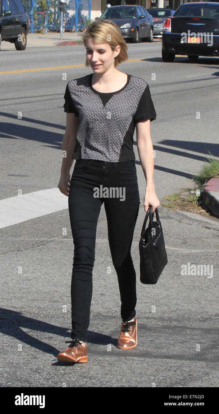 Emma Roberts out and about in a patterned top and copper shoes ...
