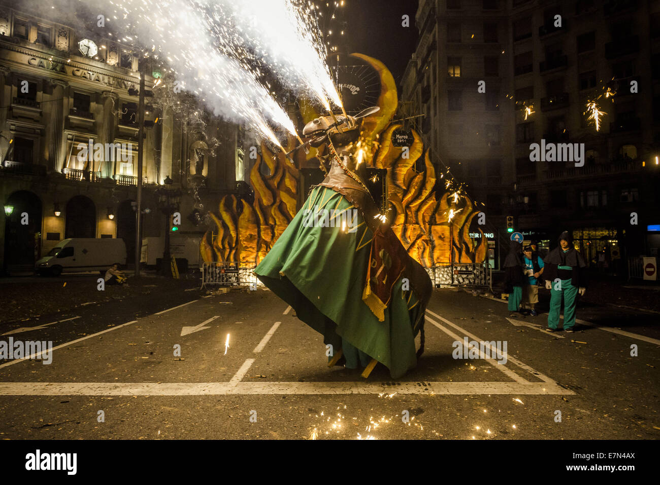 Sept. 21, 2014 - A fire beast sets off his fire crackers during ...