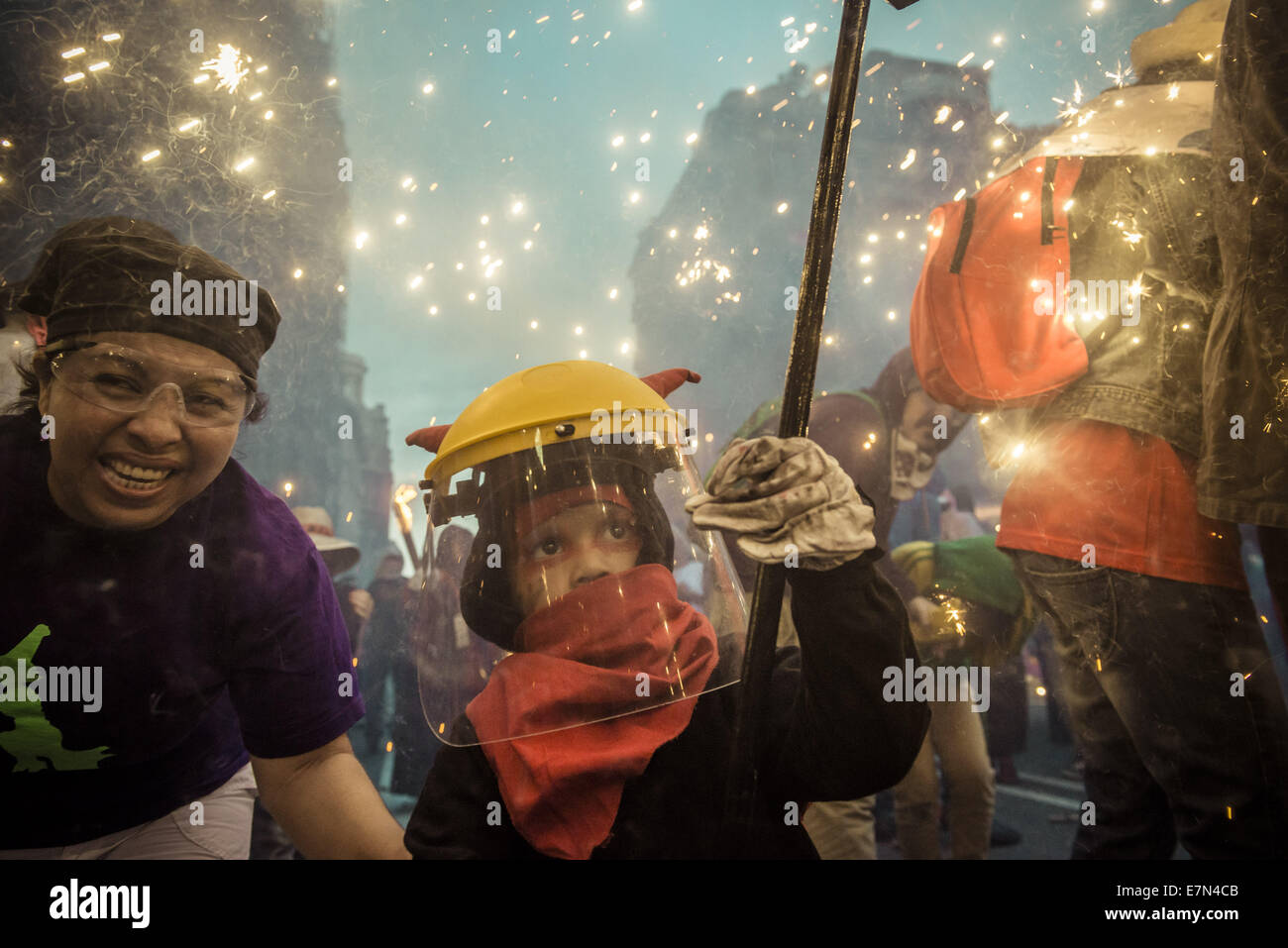 Sept. 21, 2014 - Children in devil costumes dance to traditional drums ...
