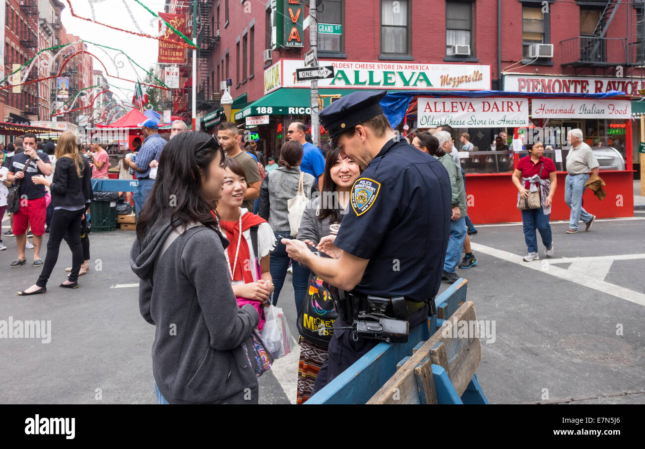 Three young Asian women asking a white NYPD officer for local ...