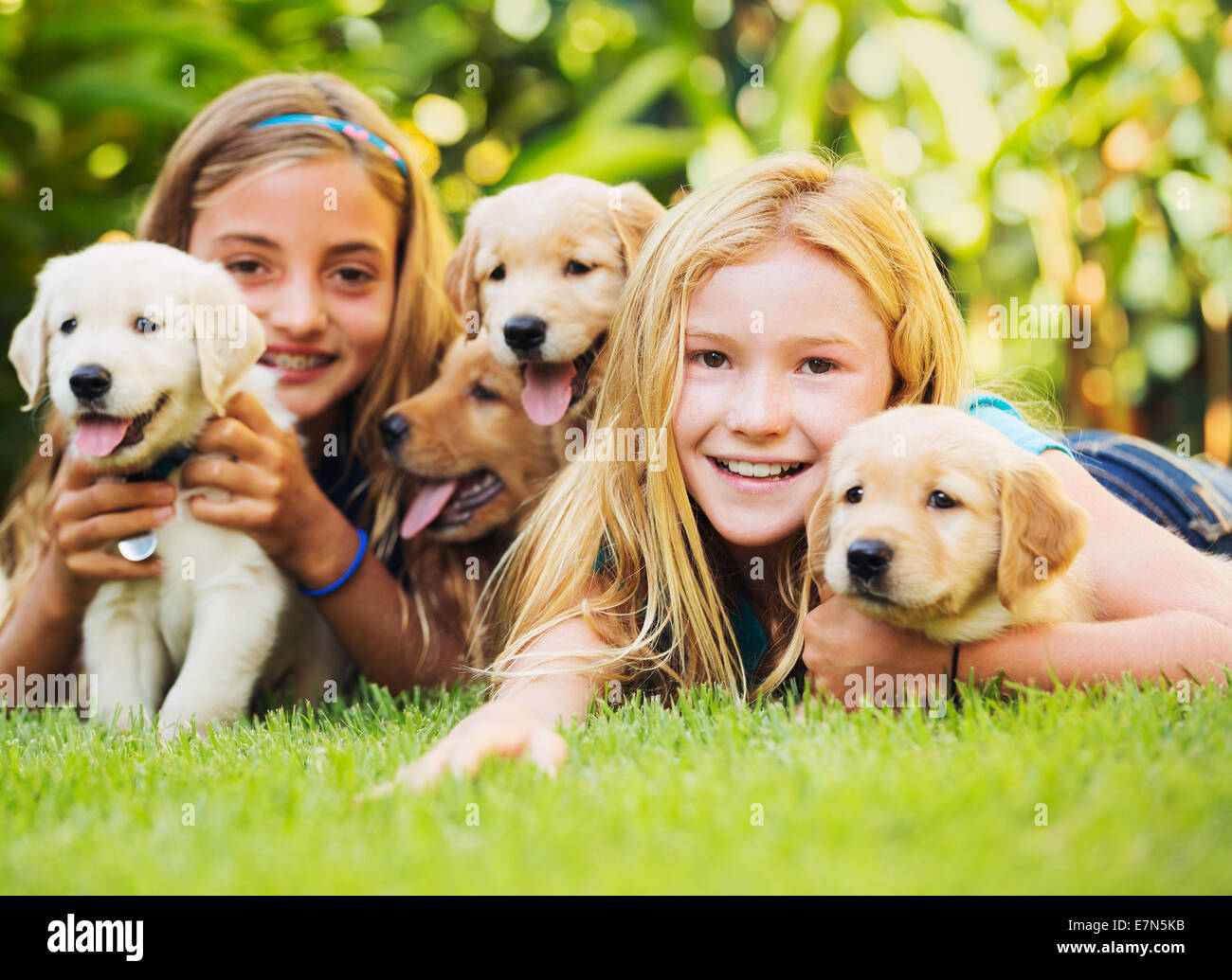 Adorable Cute Young Girls with Puppies Stock Photo - Alamy