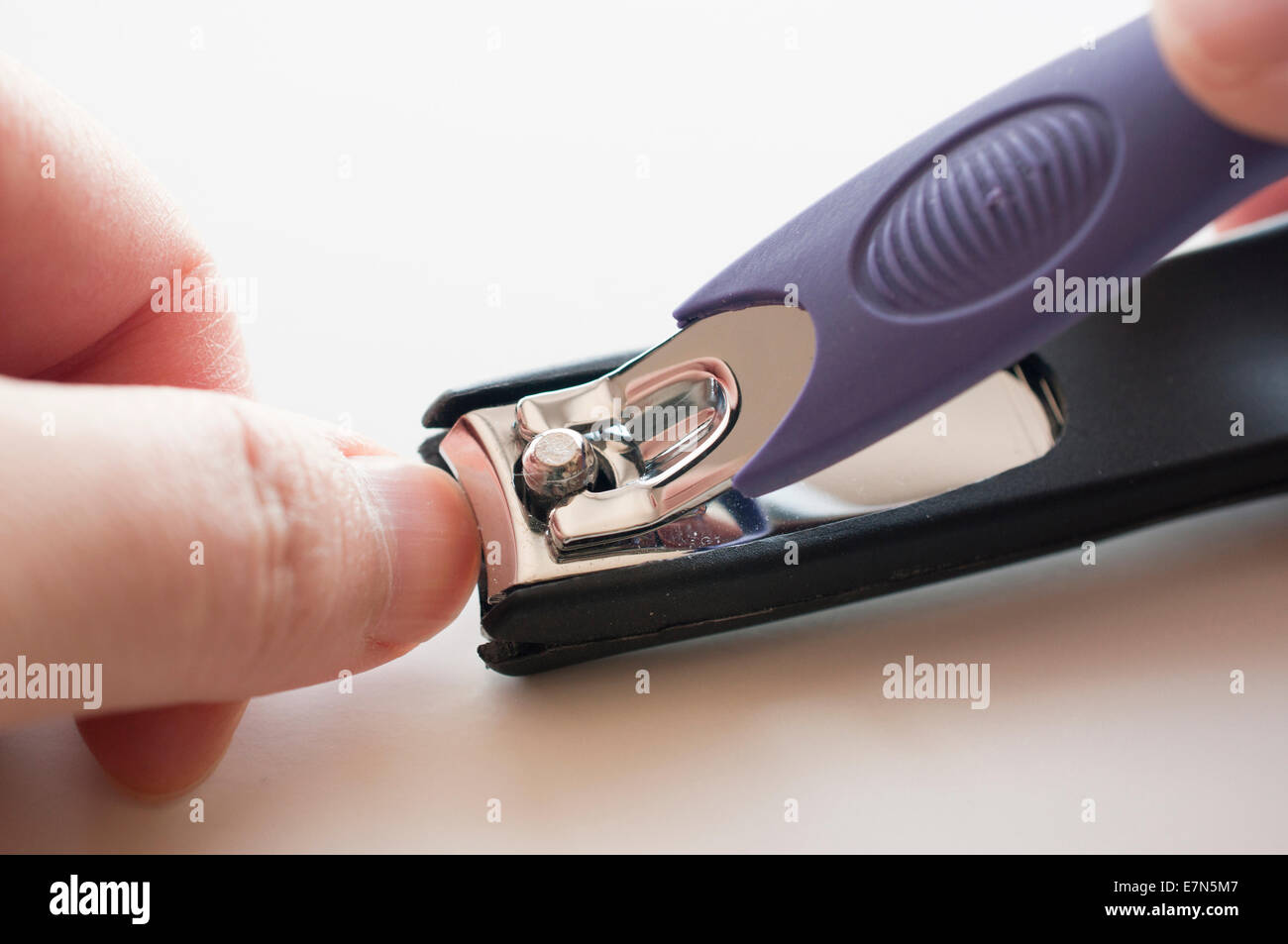 Hand manicure with nail clipper Stock Photo - Alamy