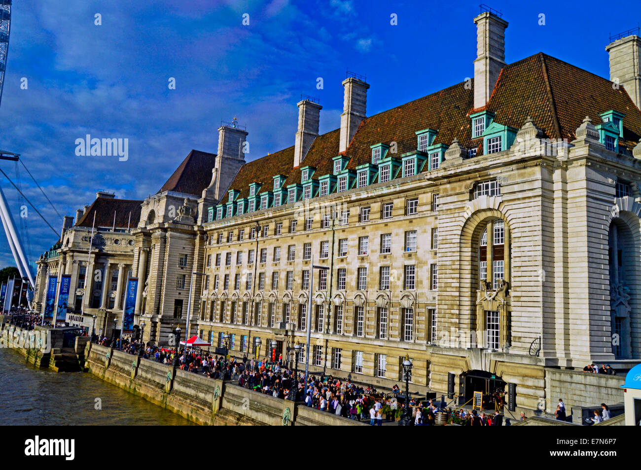 View of County Hall along the River Thames, Southbank, London, England ...