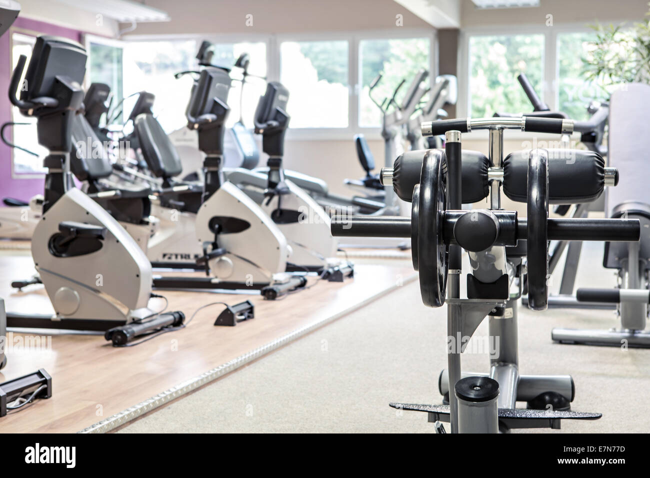 diverse equipment and machines at the gym room Stock Photo - Alamy