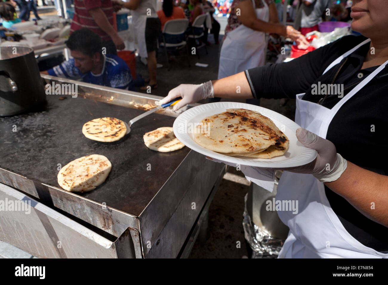 Woman making pupusas at an outdoor festival - USA Stock Photo - Alamy