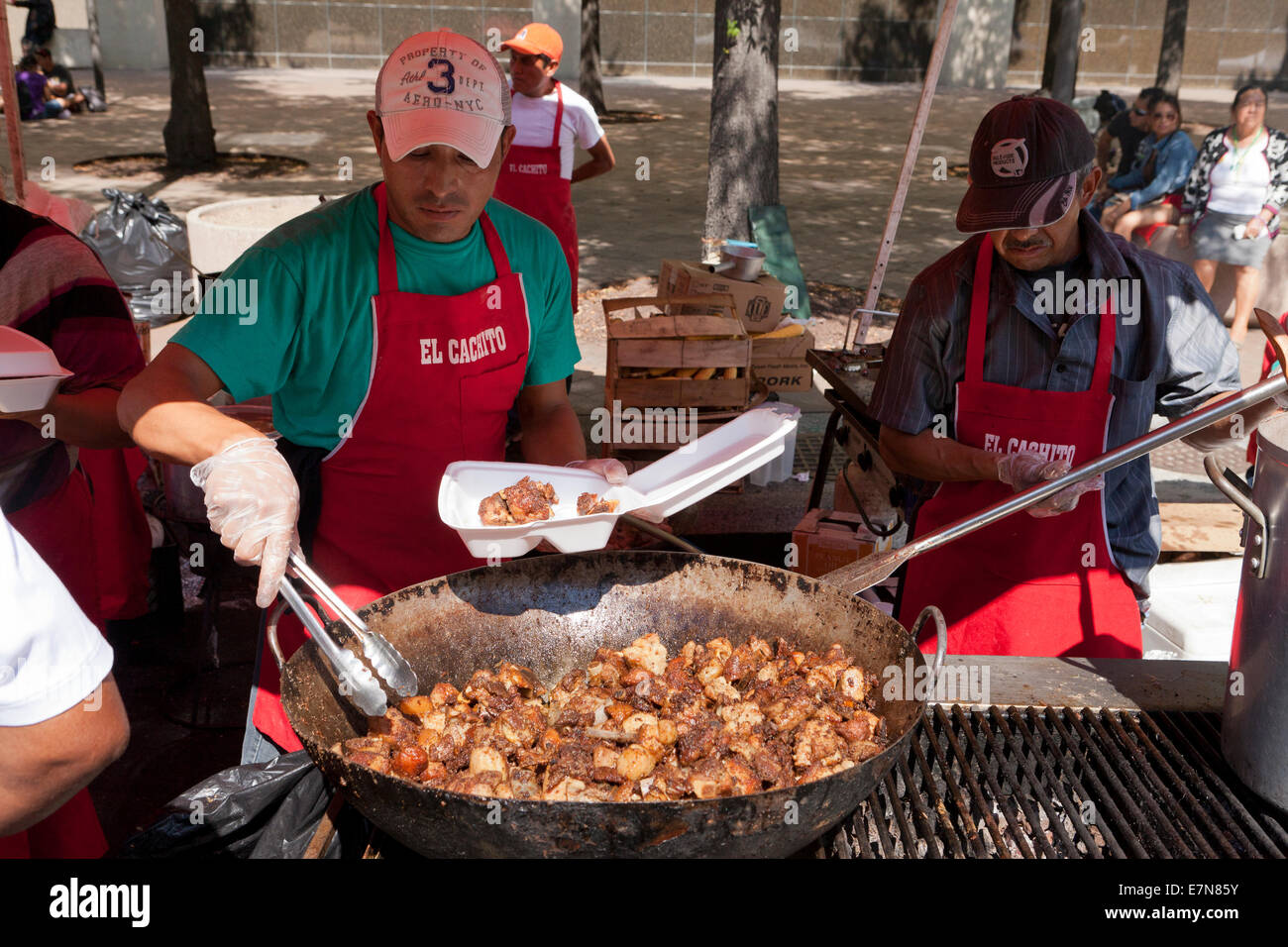 Man cooking chicharon in large pan - USA Stock Photo - Alamy